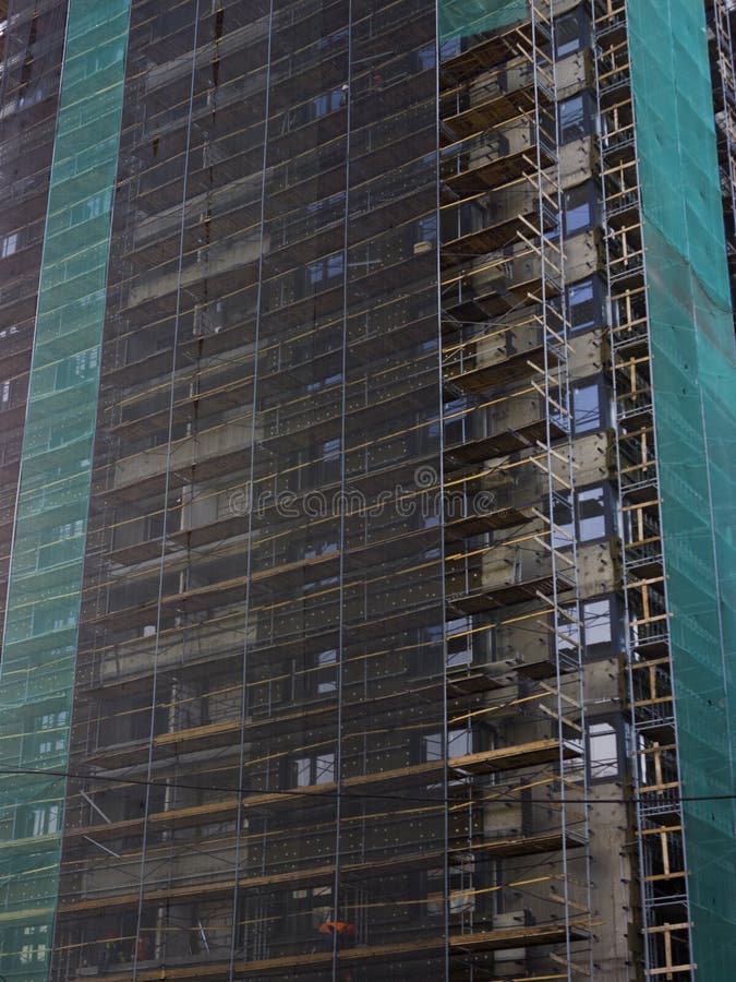 Builders are Building a Multi-storey House. Scaffolding and Materials ...