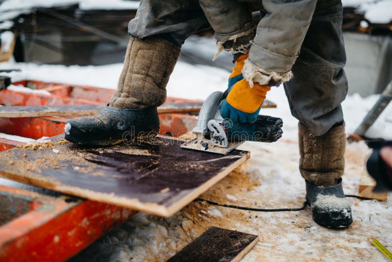 Builders at Construction Site Make Engineering Calculations and Cut ...