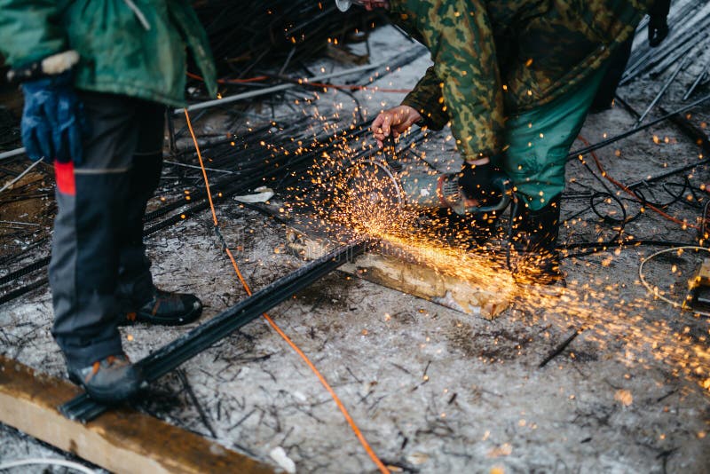 Builders at Construction Site Make Engineering Calculations and Cut ...