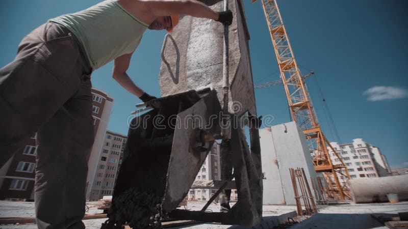 Builders in the Construction Site Fill the Cavity with Concrete Stock ...