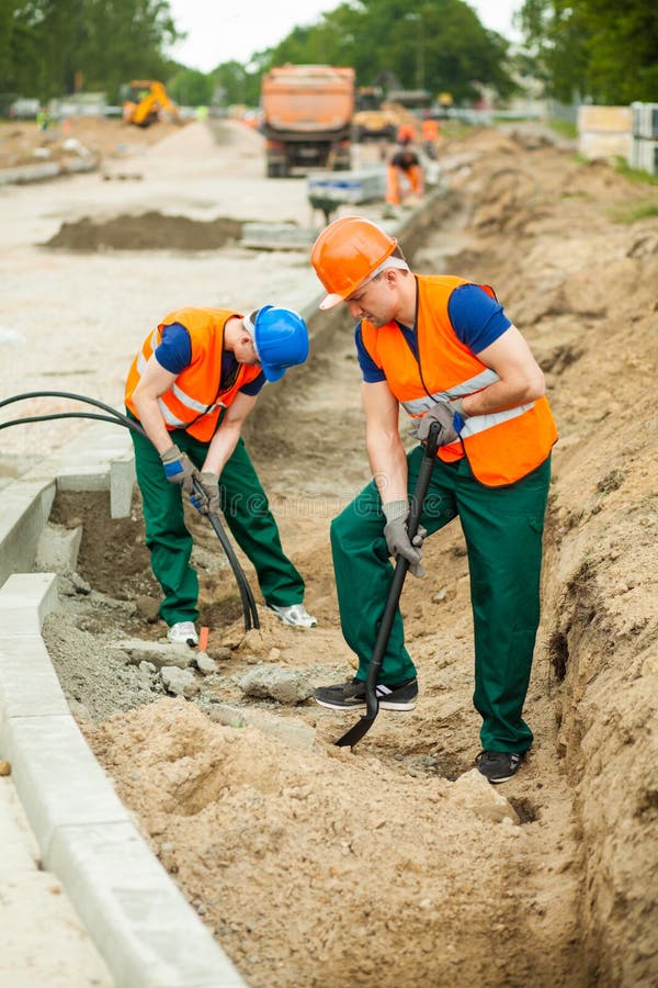 Builders working together stock image. Image of equipment - 59850755