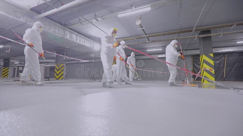 Builders are Doing the Floor in the Parking Lot. Construction Site of a ...