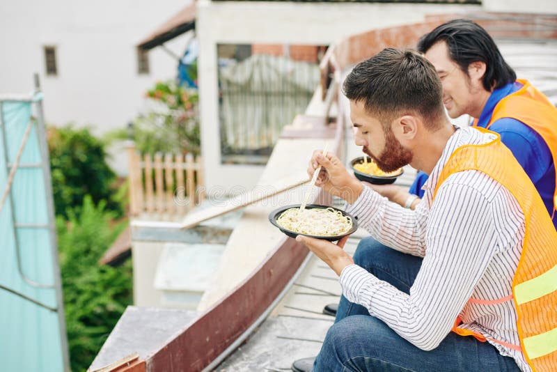 Builders eating lunch stock image. Image of builder - 188702439