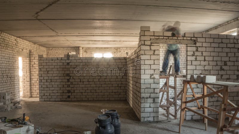 Builders Laying Brick Walls Inside Appartment with Professional ...
