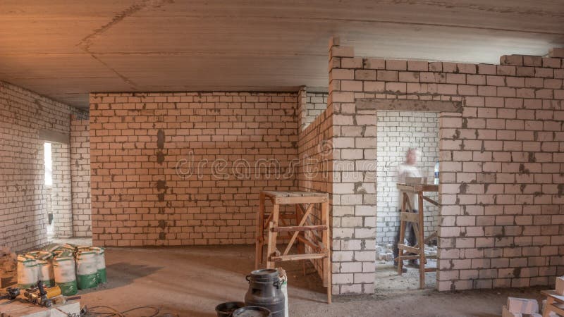 Builders Laying Brick Walls Inside Appartment with Professional ...