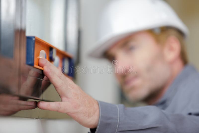 Builders Level on Window Seal Stock Photo - Image of hand, manual ...