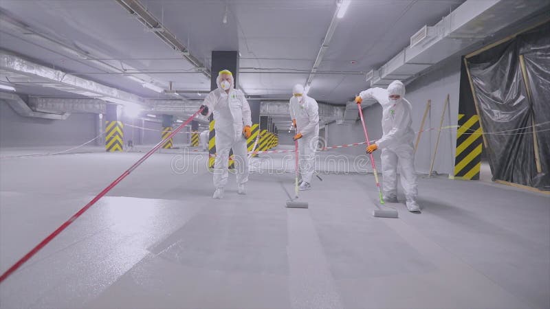 Builders are Doing the Floor in the Parking Lot. Construction Site of a ...