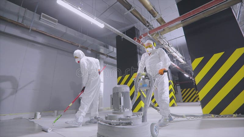 Builders are Doing the Floor in the Parking Lot. Construction Site of a ...