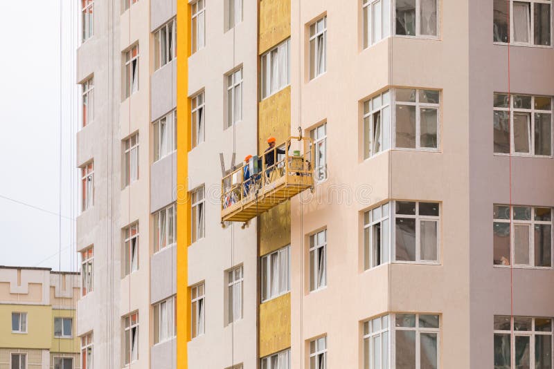 Builders Paint the Facade of a High-rise Residential Building Stock ...