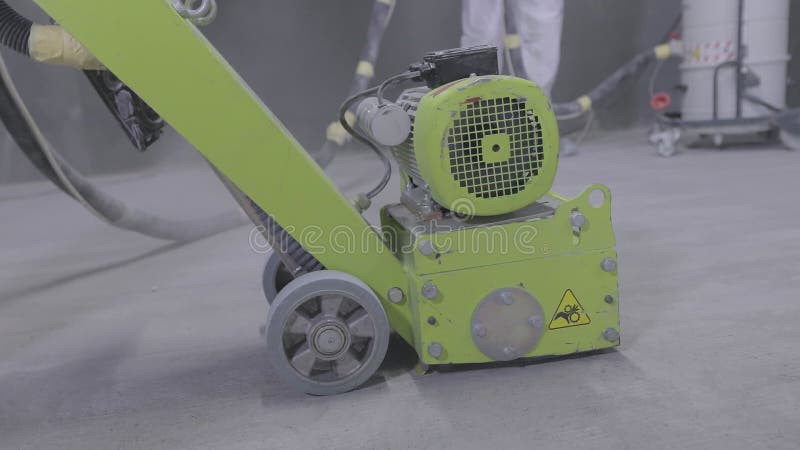 Grinding a Concrete Floor with a Grinder. Concrete Floor Processing ...