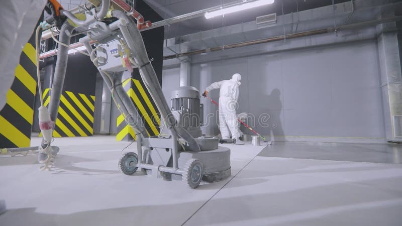 Grinding a Concrete Floor with a Grinder. Concrete Floor Processing ...