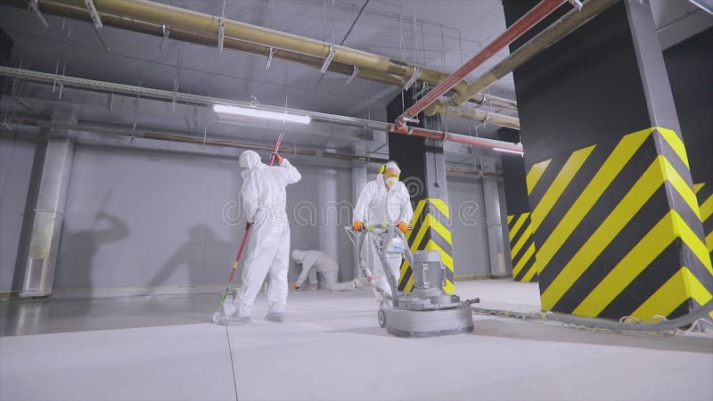 Grinding a Concrete Floor with a Grinder. Concrete Floor Processing ...