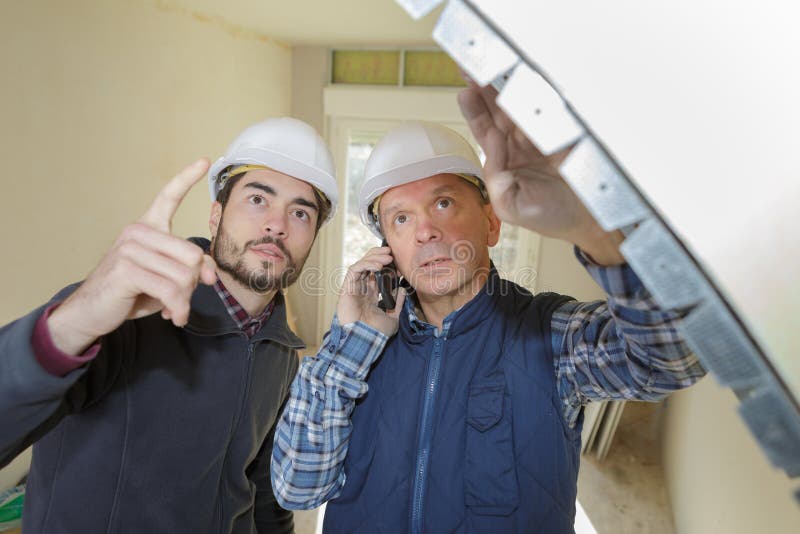 Builders on Site Using Mobile Phone Stock Image - Image of home ...