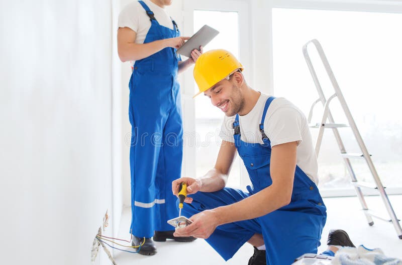Builders with Tablet Pc and Equipment Indoors Stock Photo - Image of ...