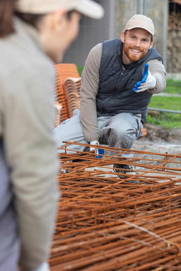 Builders Takes Long Metal Rods for Construction Reinforced Structures ...