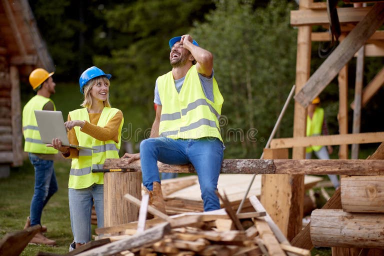 Builders are Talking about a Cottage Project at a Construction Site in ...