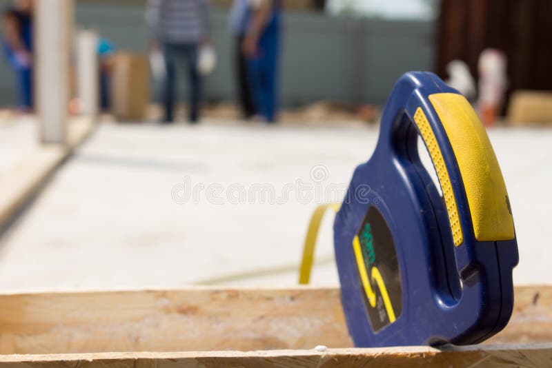 Builders Tape Measure on a Building Site Stock Image - Image of measure ...