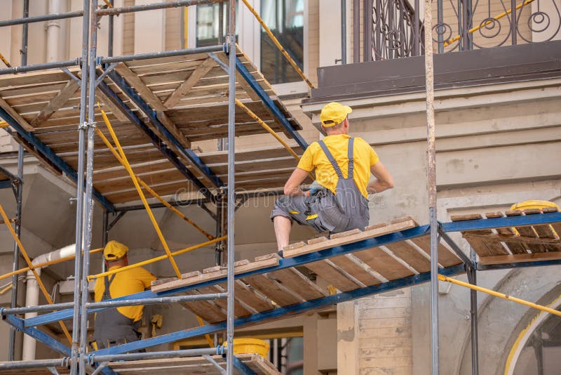 Builders in Uniform Work at a Construction Site Editorial Photography ...