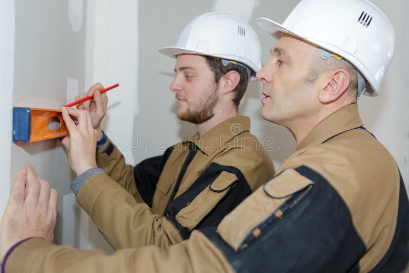 Builders Using Necessary Tool for Work Stock Photo - Image of ...