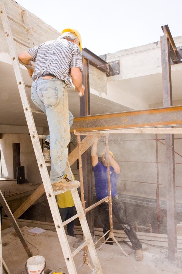 Builders at work stock image. Image of house, brick, builders - 35691673