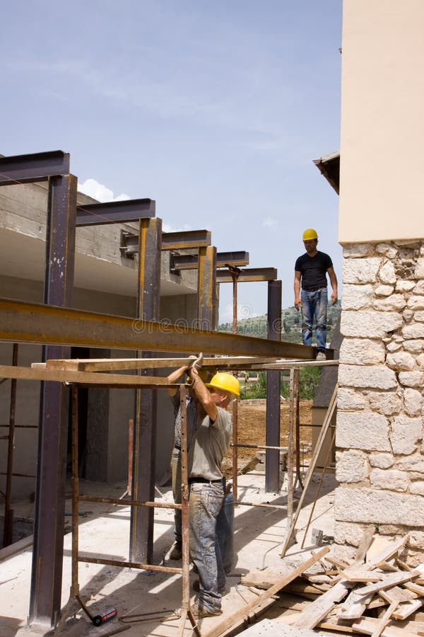 Builders at work stock image. Image of house, brick, builders - 35691673