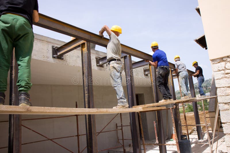 Builders at work stock image. Image of house, brick, builders - 35691673