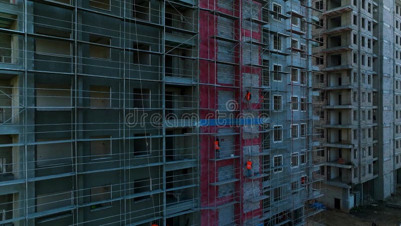 Builders Work Facing the Building Stand on the Scaffolding Stock Video ...