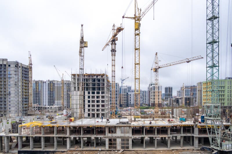 Builders Work on Large Construction Sites, and There are Many Cranes ...