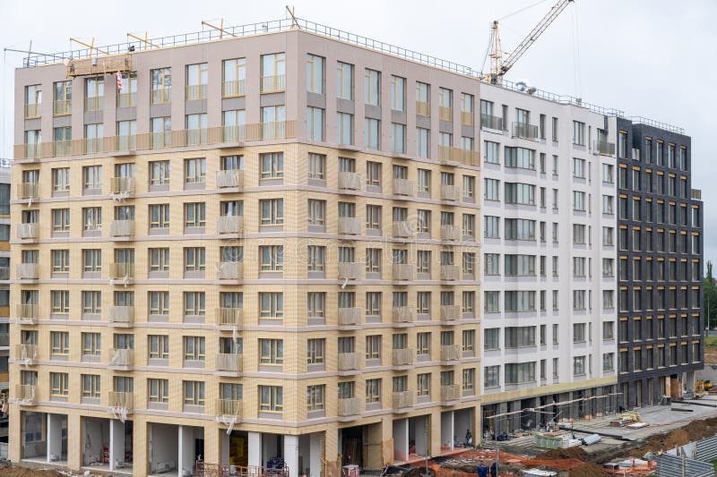 Builders Work on Large Construction Sites, and There are Many Cranes ...