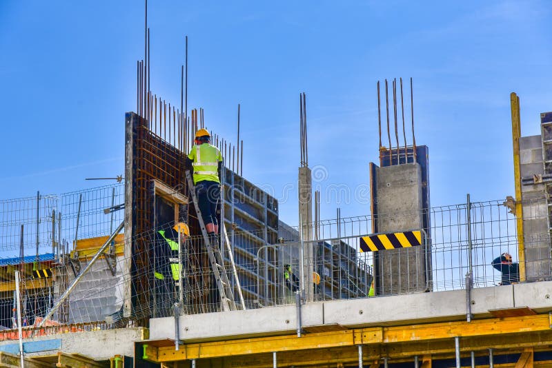 Builders Workers at a House Construction Site are Installing ...