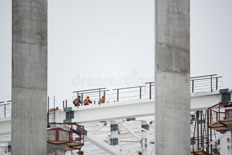 Builders Working on the Construction of a Large Building Stock Photo ...