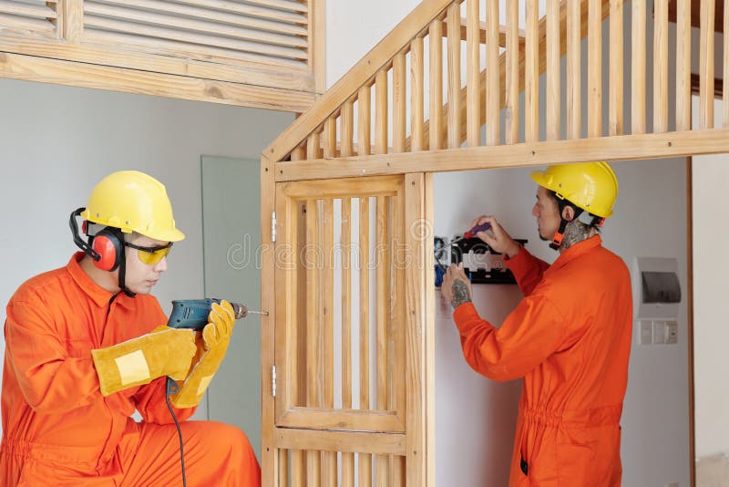 Builders Working in House stock photo. Image of manager - 234644112