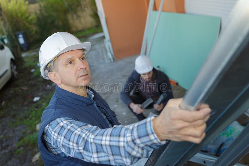 Builders working on site stock photo. Image of repairing - 96541164