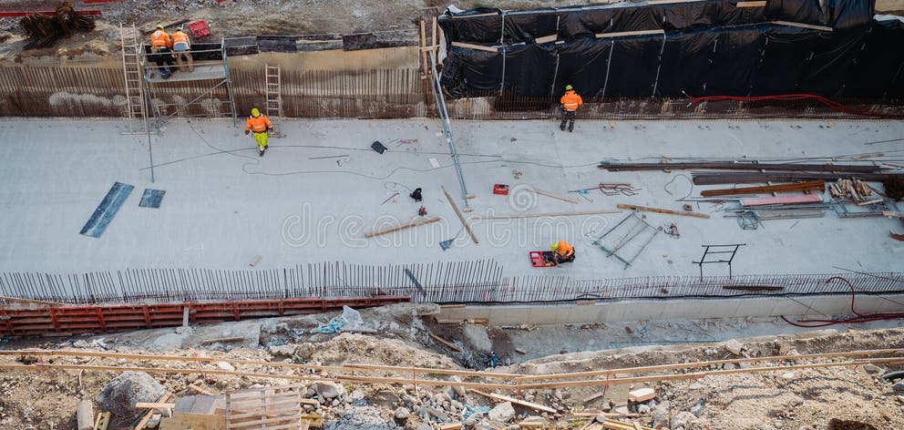 Builders Working on Structural Development at an Active Construction ...