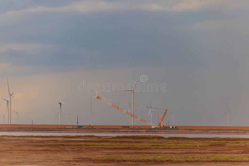 Building and Assembling Construction Wind Turbines Farm by a Crane ...