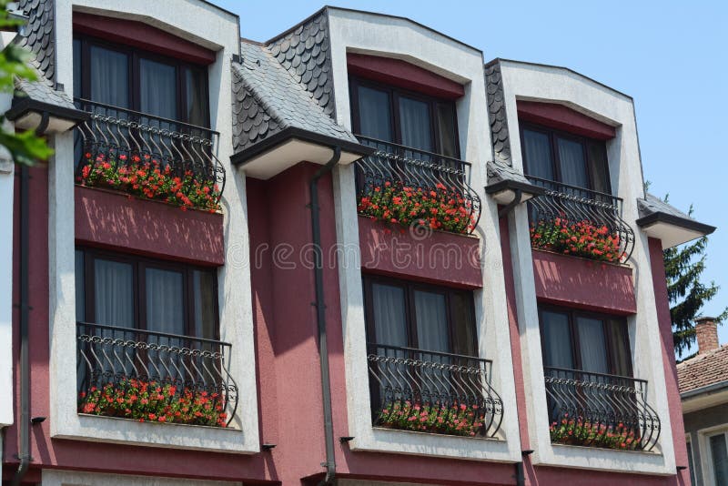 Building with Beautiful Flowers on Balconies Outdoors Stock Image ...