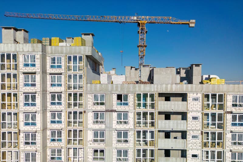 A Building Being Constructed with a Crane Positioned on Top, Showing ...
