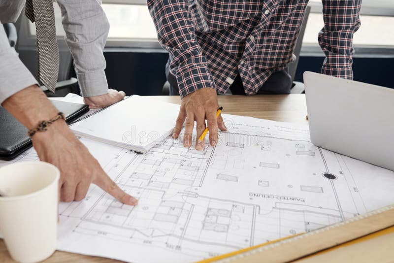 Building Blueprint in Tablet of Construction Engineers Stock Photo ...