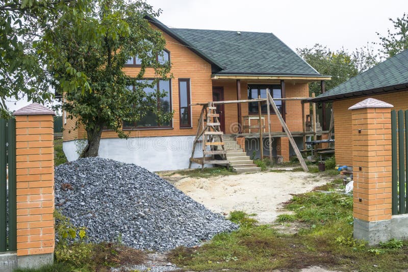 Building Brick House Outside the City. Foreground with Scaffolding ...