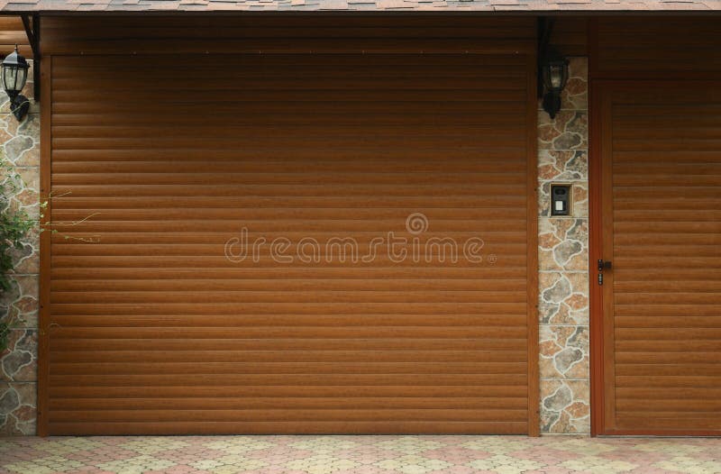 Building with Brown Roller Shutter Garage Door Stock Photo - Image of ...