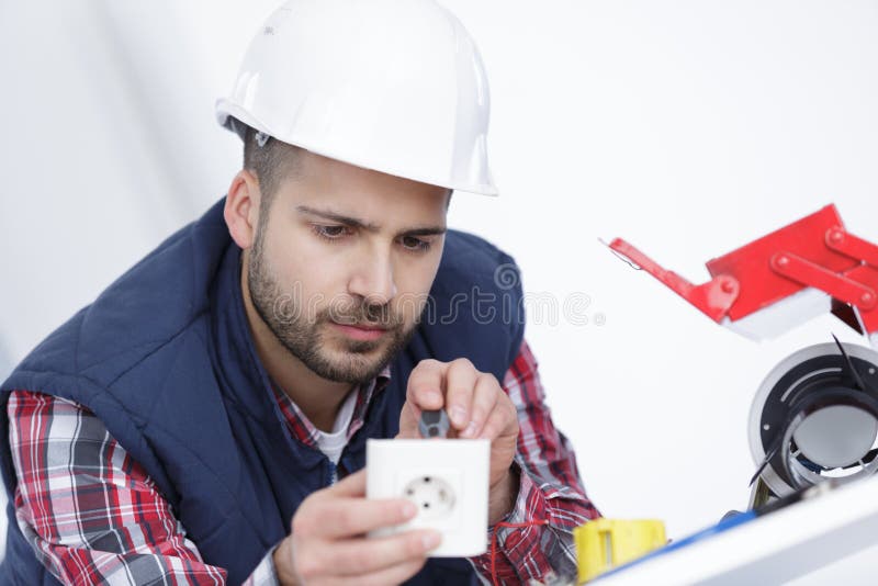 Building Builder with Screwdriver Fixing Socket Indoors Stock Photo ...