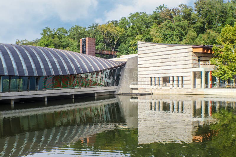 Building Built Part Way Over Water in Small Lake Reflecting on it Stock ...
