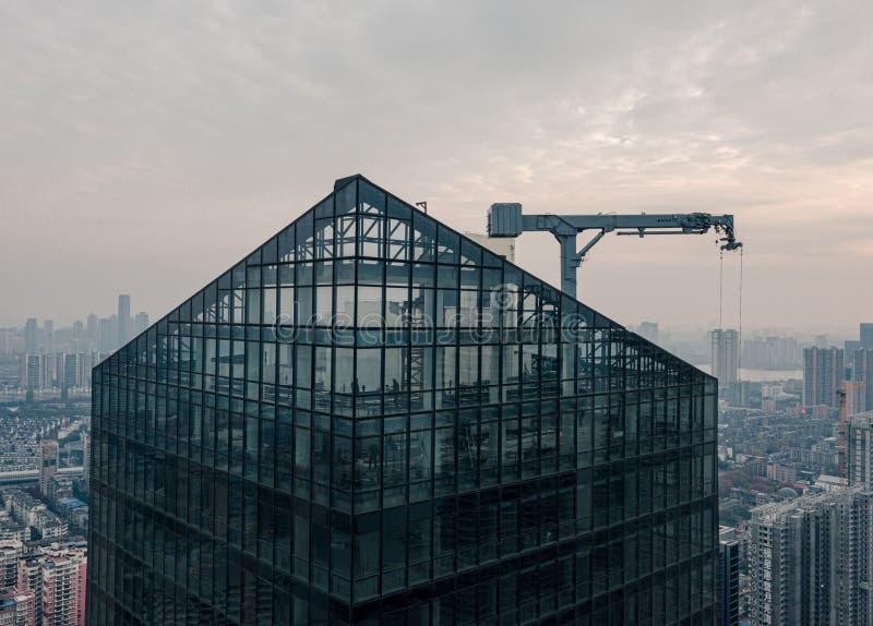A Building in a City with Large Windows Overlooking a Skyscraper ...