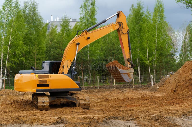 An Excavator is Digging a Pit for a House. Stock Image - Image of dirt ...