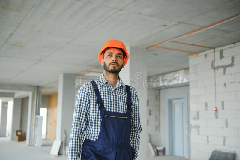 Building, Construction and People Concept. Builder at Construction ...
