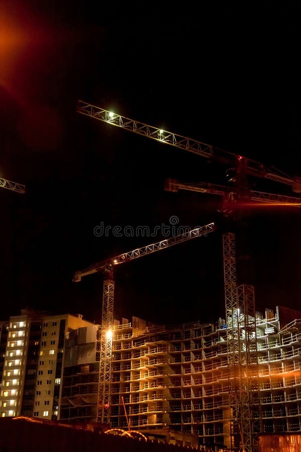 Construction Cranes Work on Creation Site Against Sky Background Stock ...