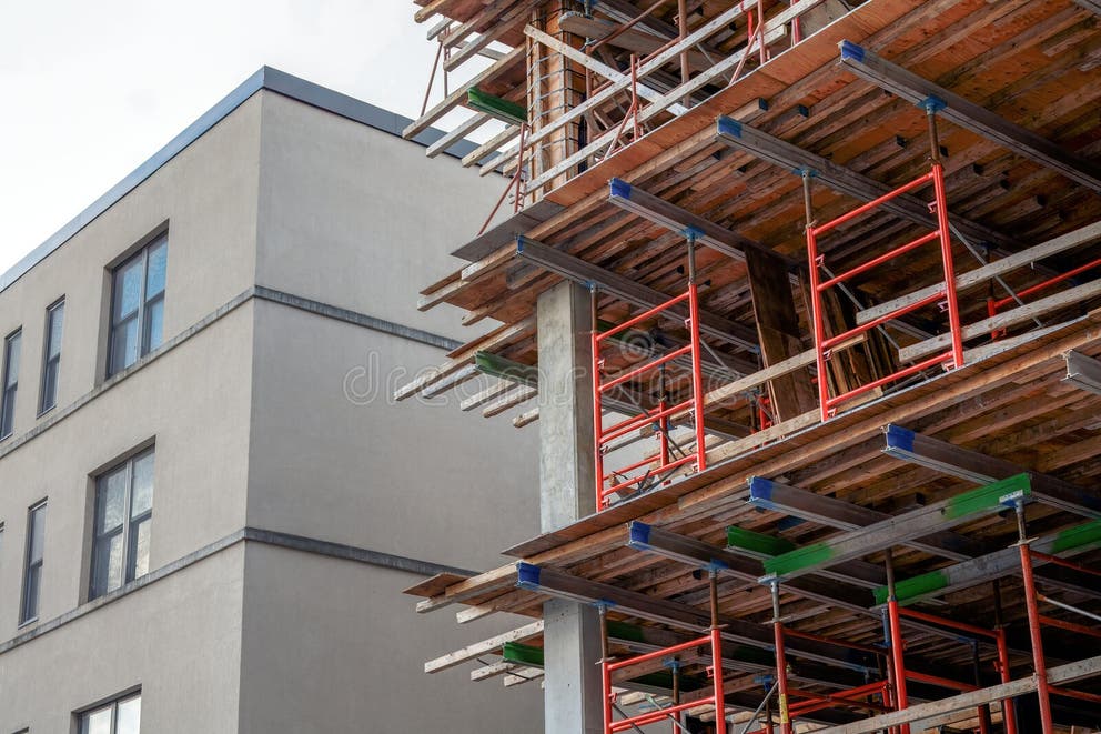 Building Construction Site with Scaffolding and Modern Architecture ...
