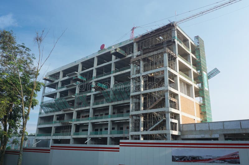 Building Construction and Tall Crane in Morning Light Stock Photo ...