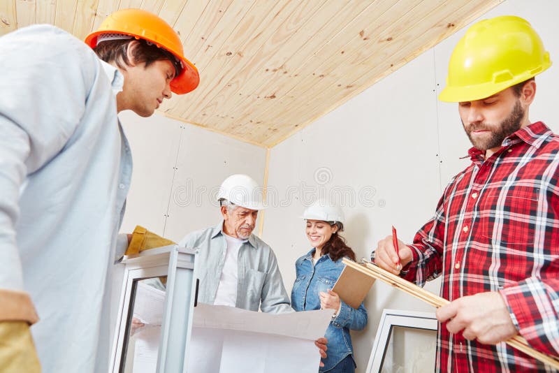 Building Construction Team Working on Floorplan Stock Image - Image of ...