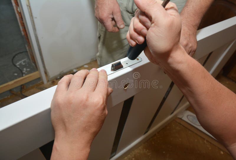 Building Contractor is Installing Mortise Lock into a Bathroom Door ...